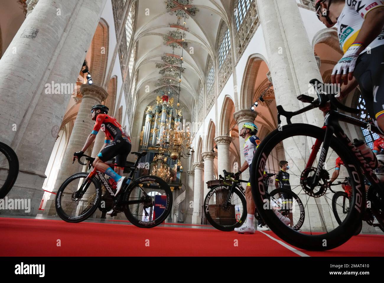 Riders pass through the Grote Kerk, or Large Church, during the third stage of the Vuelta ...