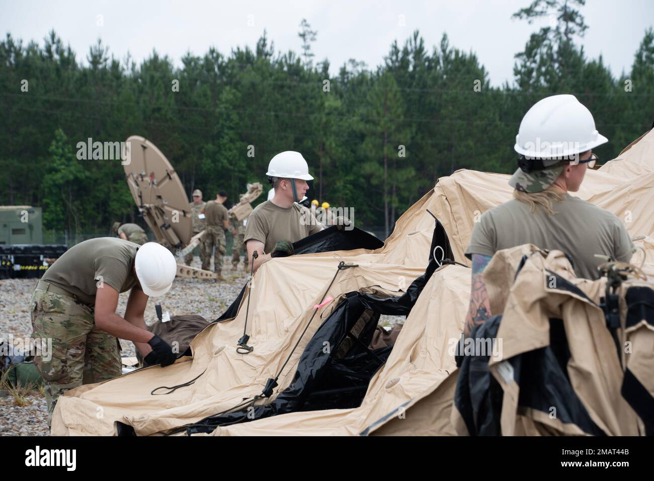 Members of the 239th Combat Communications Squadron set up a temporary ...