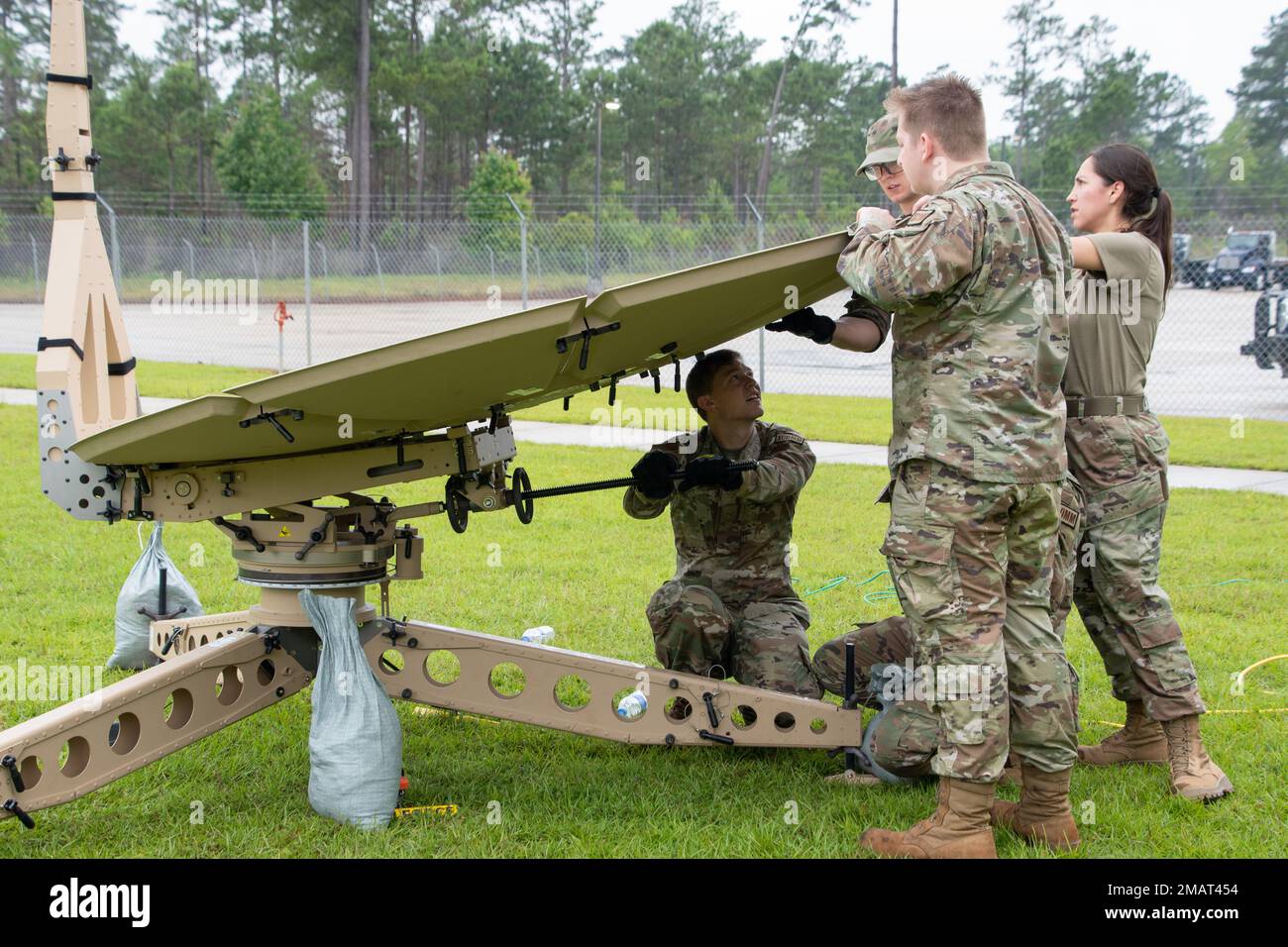 Members of the 239th Combat Communications Squadron ready a satellite ...