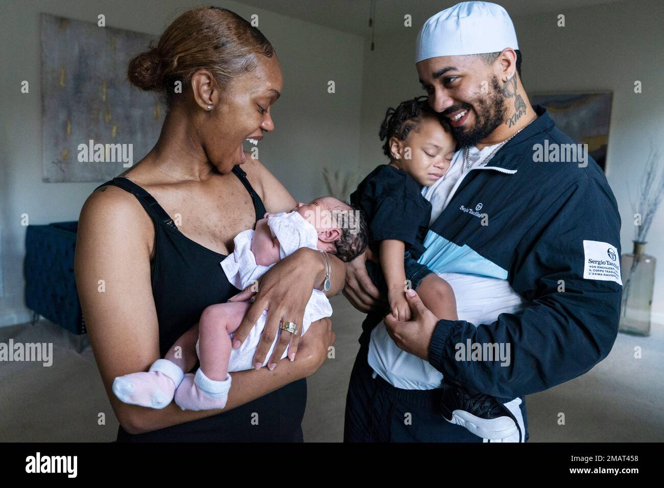 Aaliyah Wright, 25, of Washington, reacts on seeing a smile from her ...