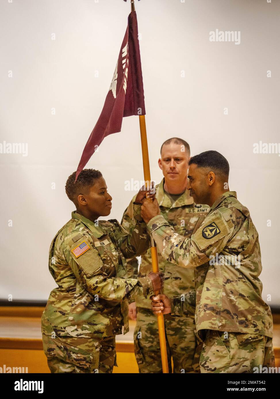 1SG Vincent Nunez passes the WRAIR flag to CPT Shanee Allen while SFC ...