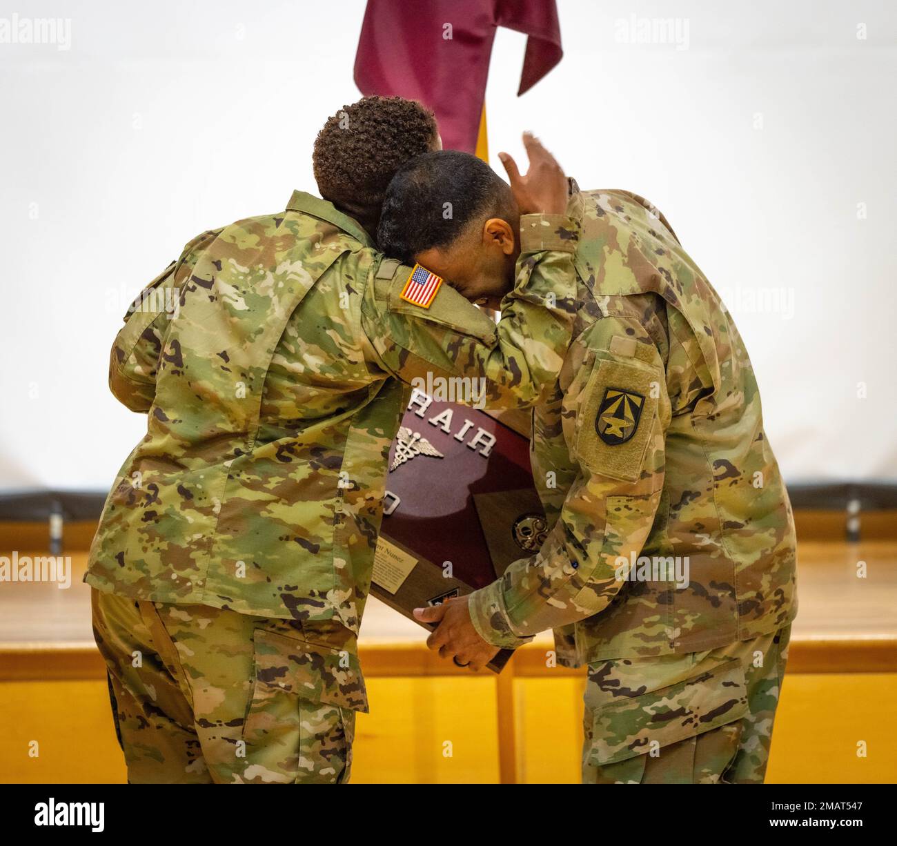 CPT Shanee Allen and 1SG Vincent Nunez share a hug after receiving ...