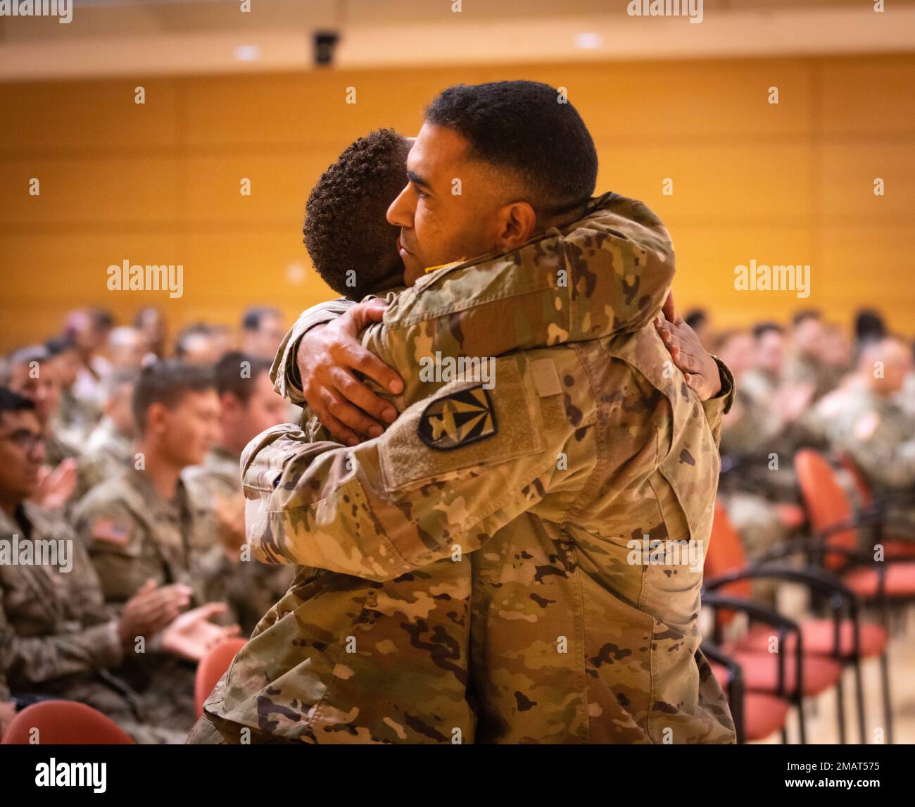 CPT Shanee Allen and 1SG Vinvent Nunuez share a hug at the relinquish ...