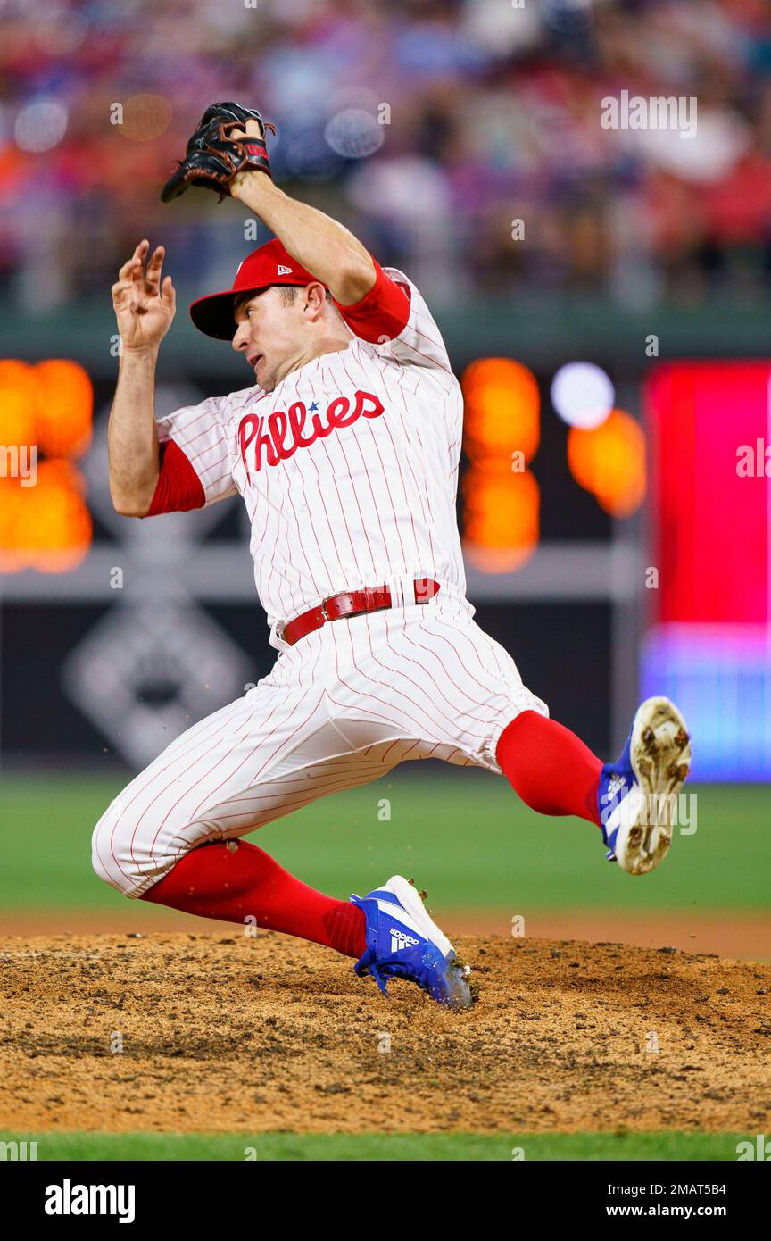Philadelphia Phillies relief pitcher David Robertson catches the pop up by New York Mets' James ...