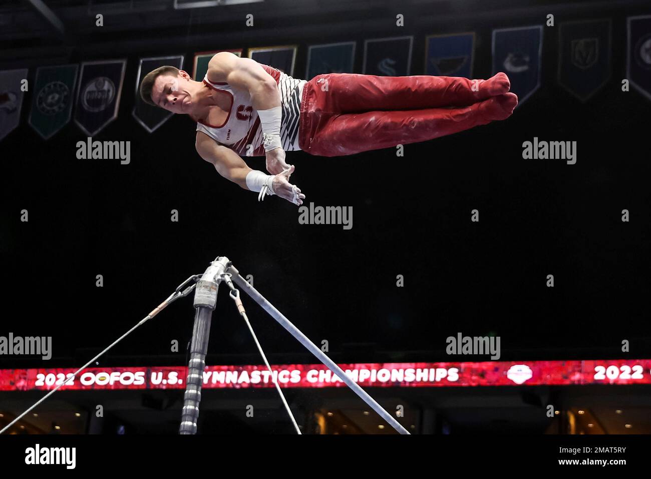 Brody Malone competes on the high bar during the U.S. Gymnastics ...