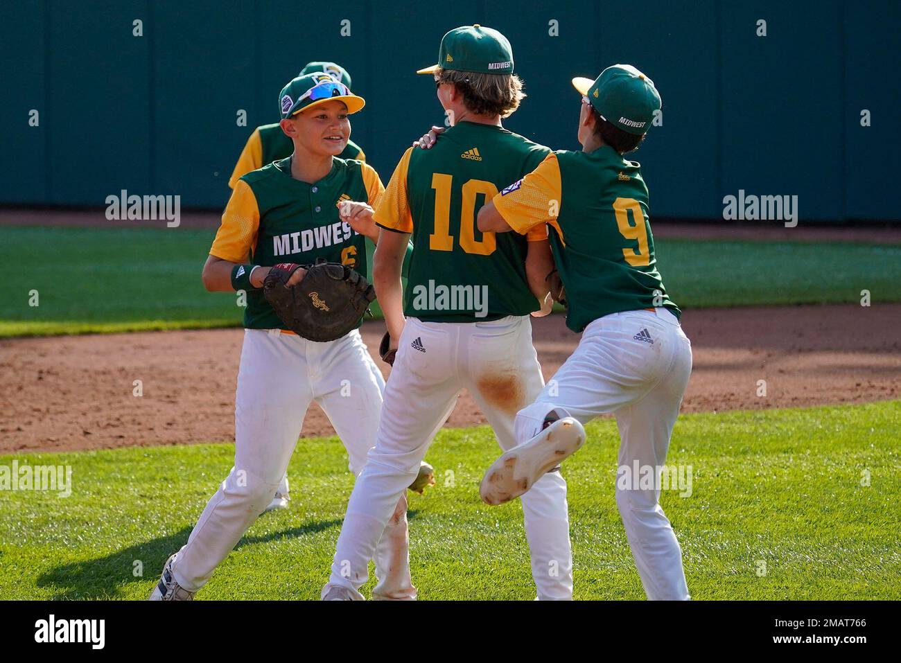 Davenport, Iowa's Mason McFate (10) celebrates with Jameson Andresen (6 ...