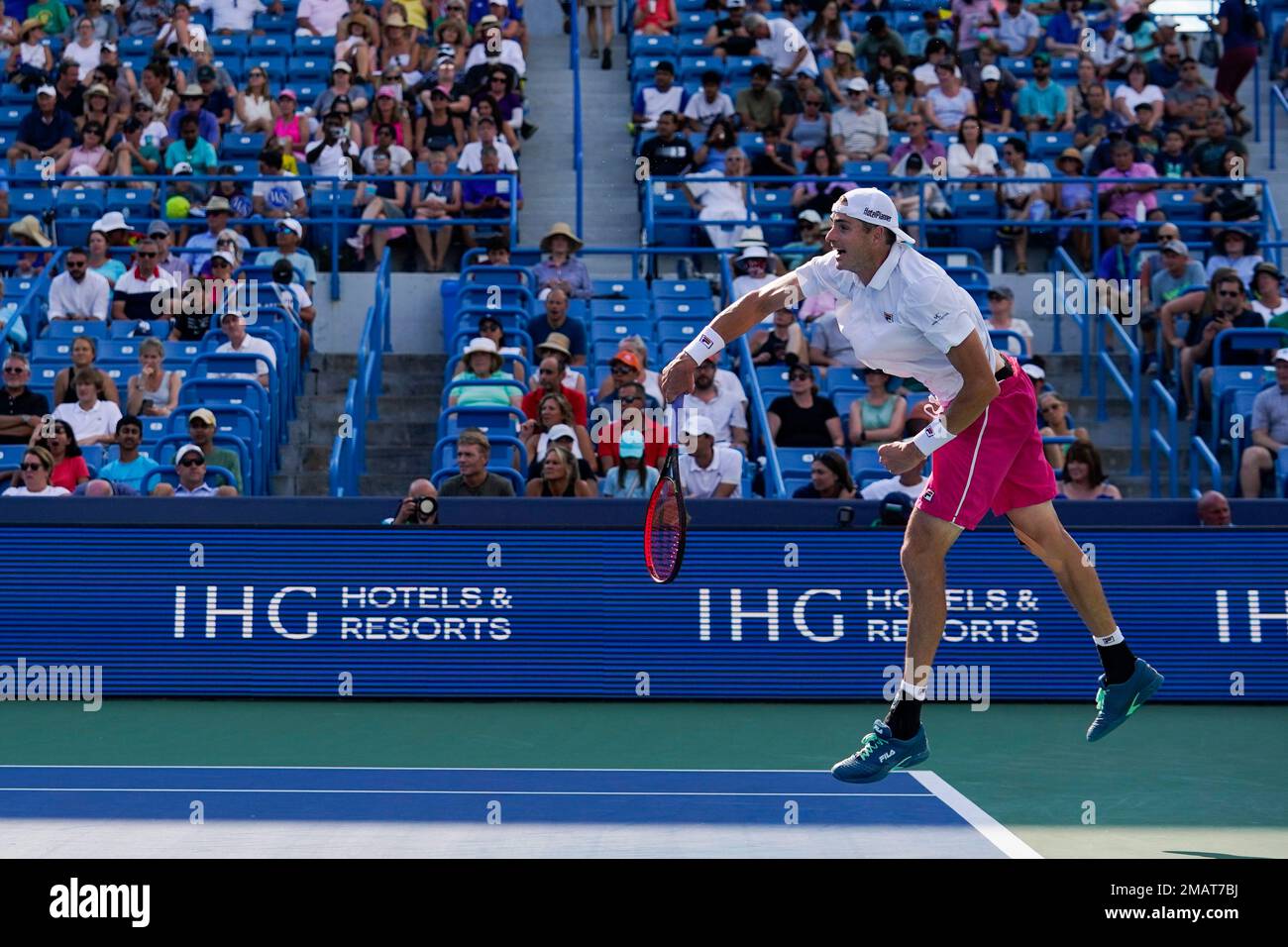 John Isner, of the United States, plays during the Western & Southern ...