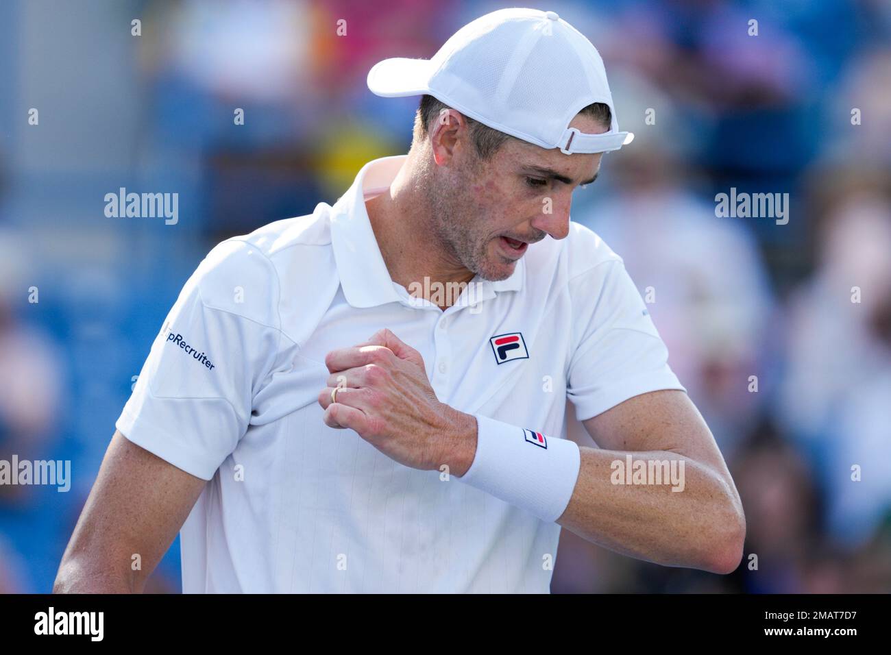 John Isner, of the United States, plays during the Western & Southern ...