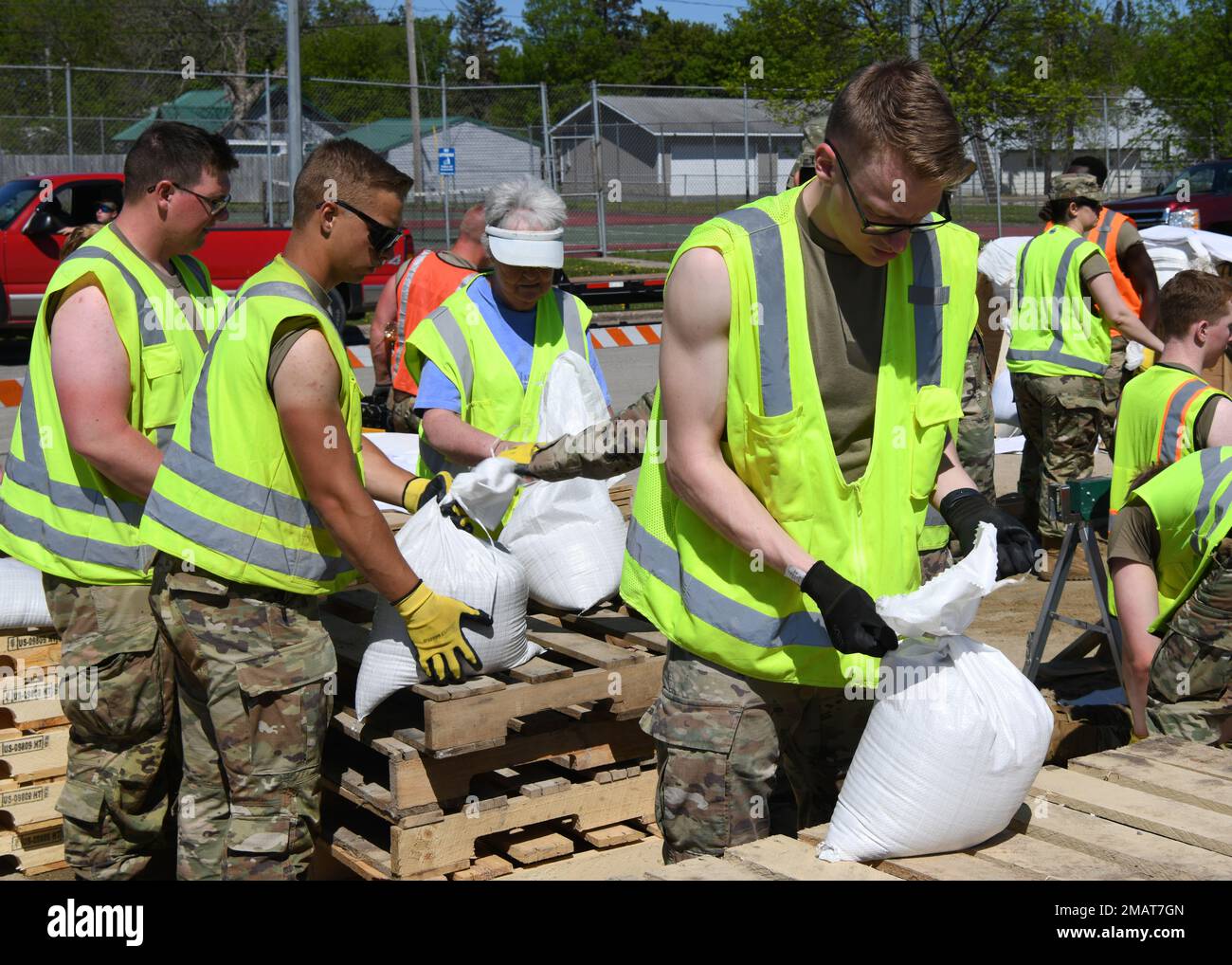 Soldiers of the 1st Battalion, 94th Cavalry Regiment fill sandbags in ...