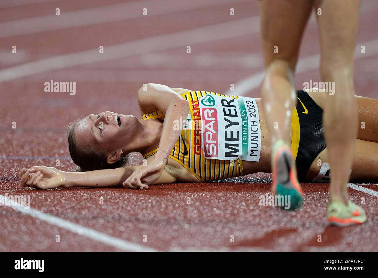 Lea Meyer, of Germany, reacts after crossing the finish line to win the ...