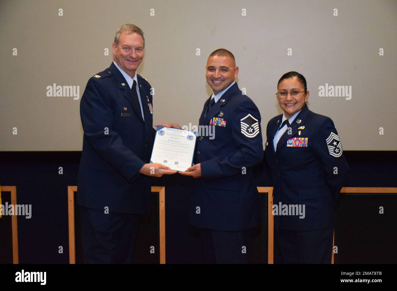 Master Sgt. Eric Jaime, 433rd Logistics Readiness Squadron, receives a certificate of ...