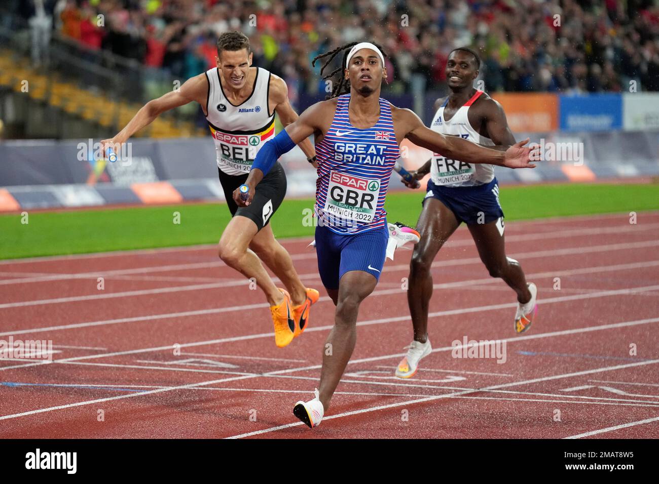 Alex Haydock-Wilson, of Great Britain, center, reacts as he crosses the ...