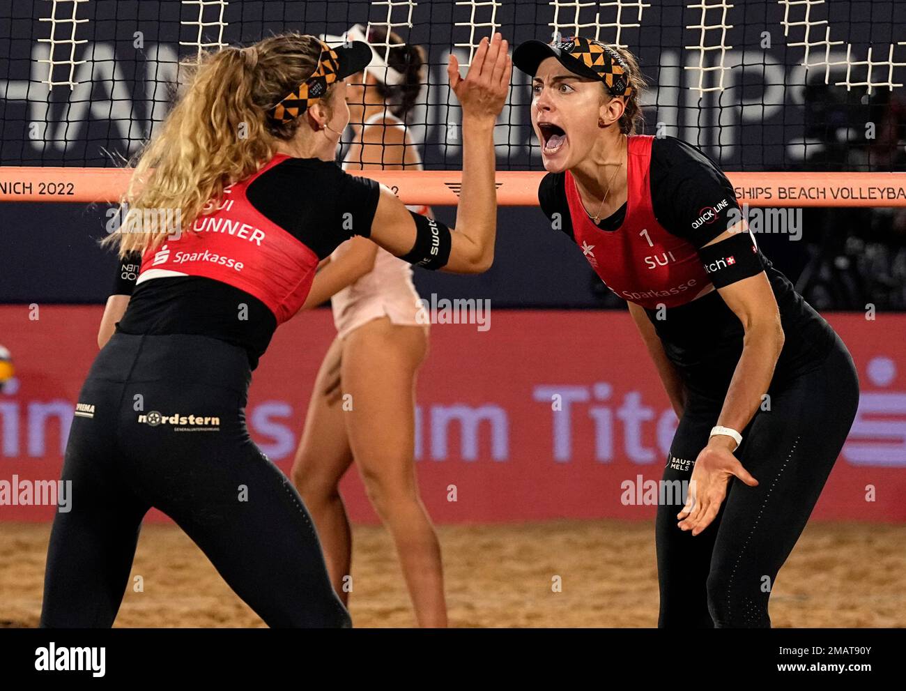 Switzerland's Tanja Huberli and Nina Brunner celebrate winning a point ...