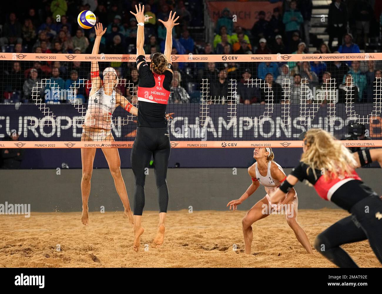 Switzerland's Tanja Huberli and Nina Brunner, front, in action against ...