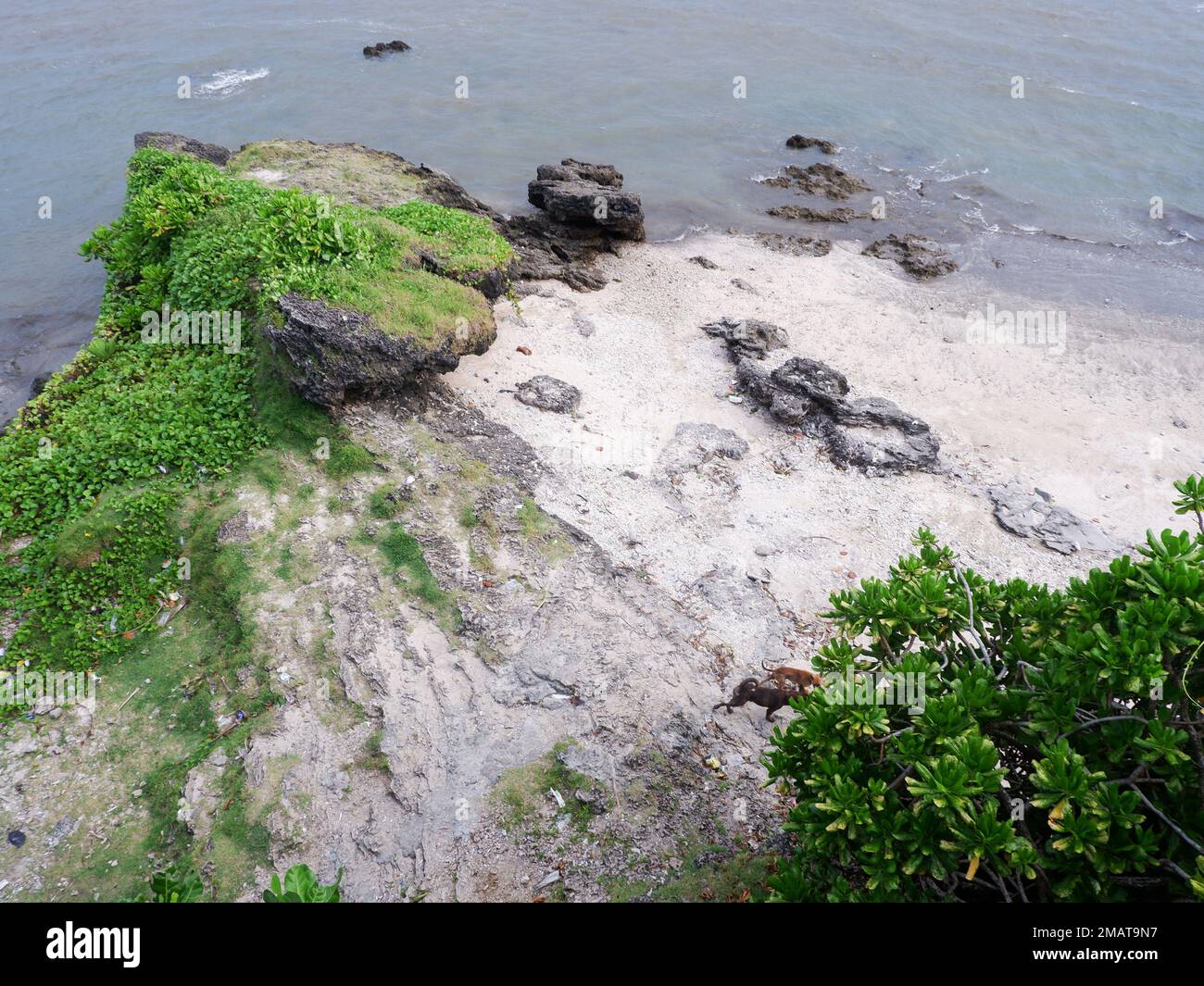 Boulder within the island , Red rock Stock Photo - Alamy