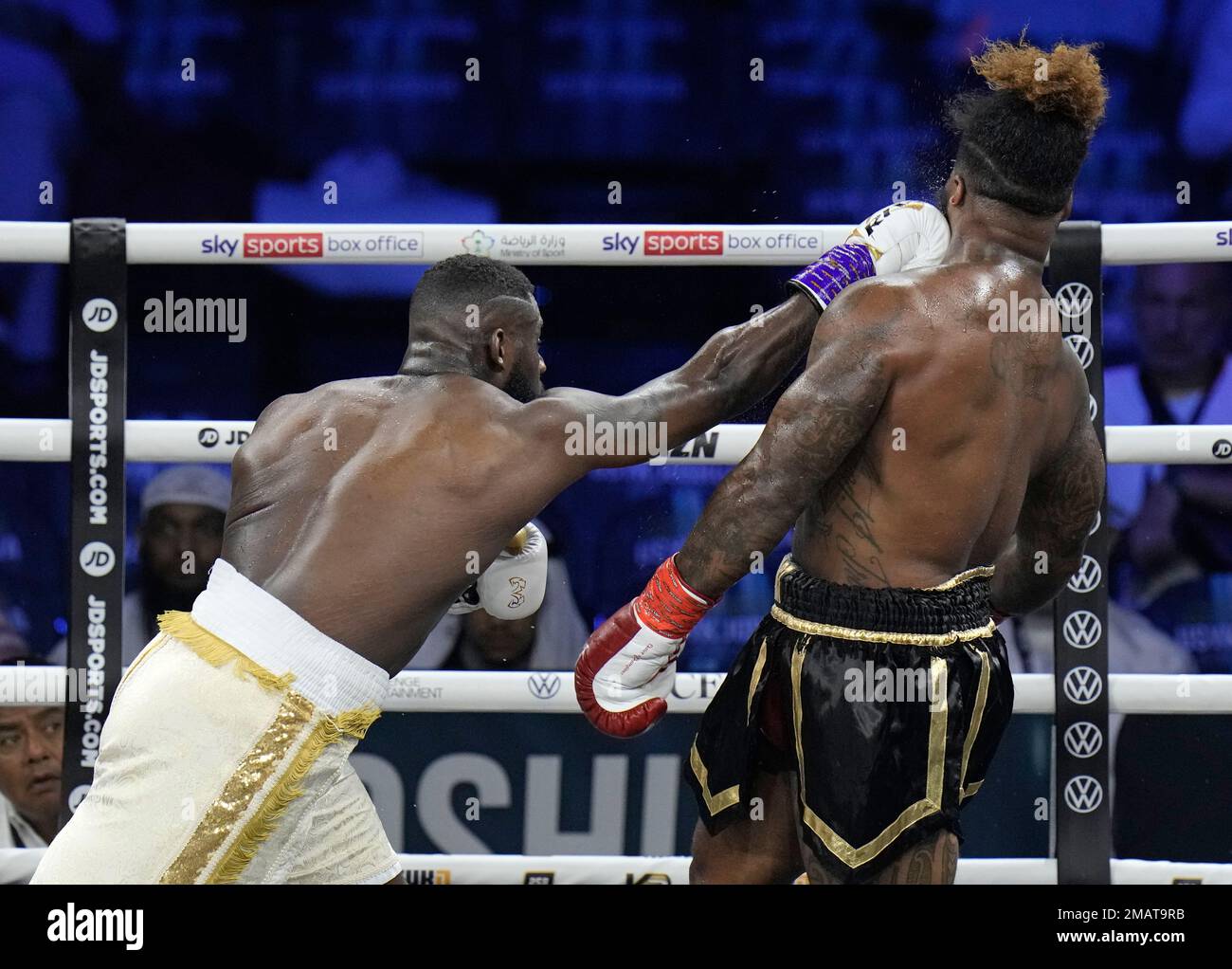 Andrew Tabiti of the United States, left, lands a blow on James Wilson ...