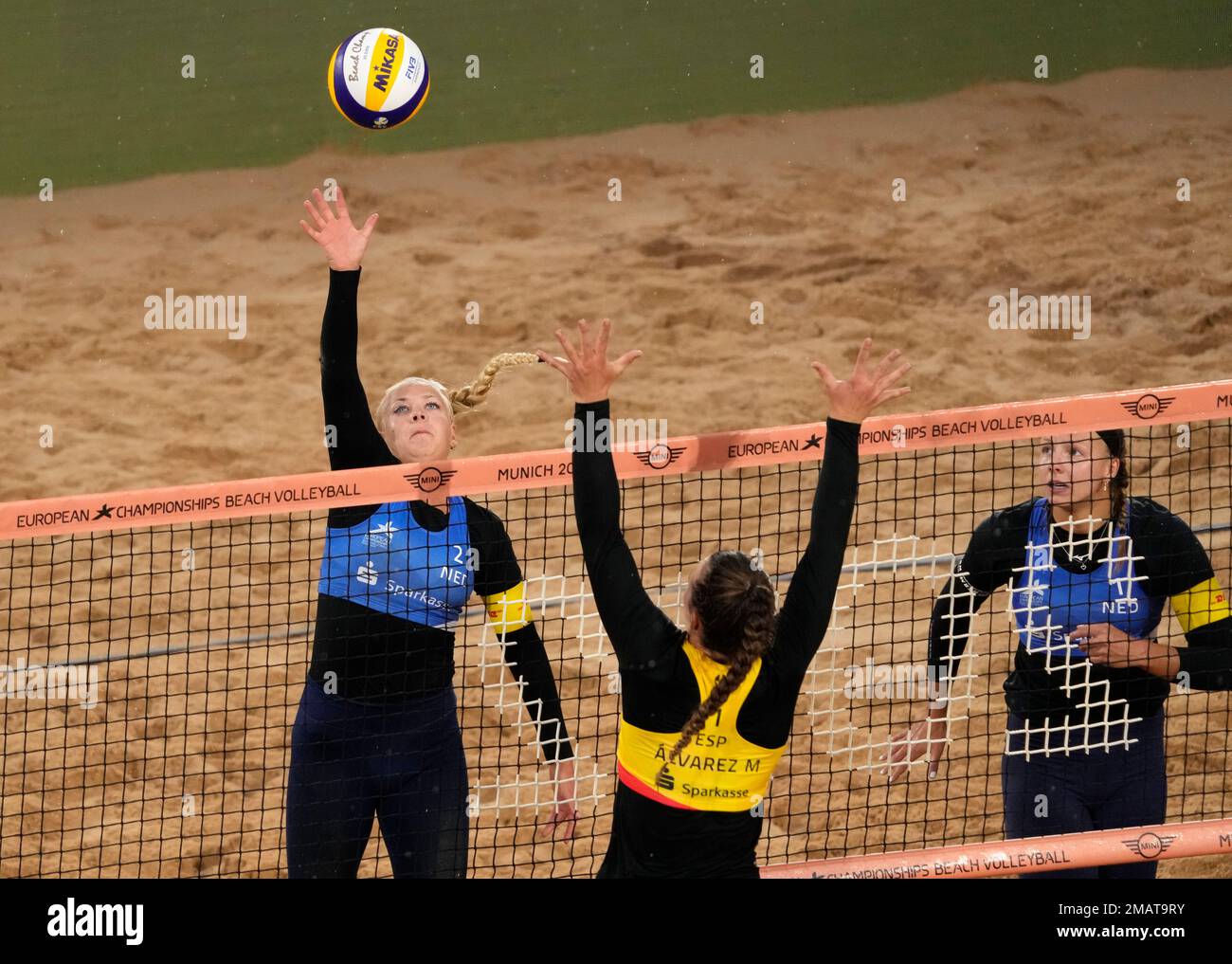 Spain's Daniela Alvarez Mendoza, centre, tries to block Raisa Schoon ...