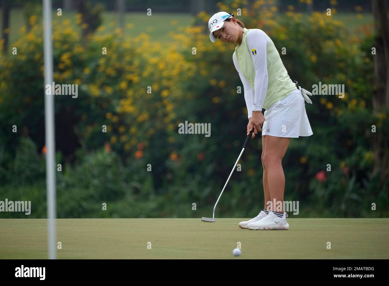 Japan's Hinako Shibuno putts on the 13th green during Simone Asia Pacific Cup golf tournament at ...
