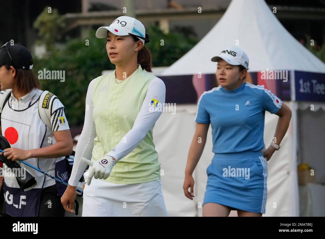 Japan's Hinako Shibuno, left, walks with her sister Kiriko, right, during Simone Asia Pacific ...