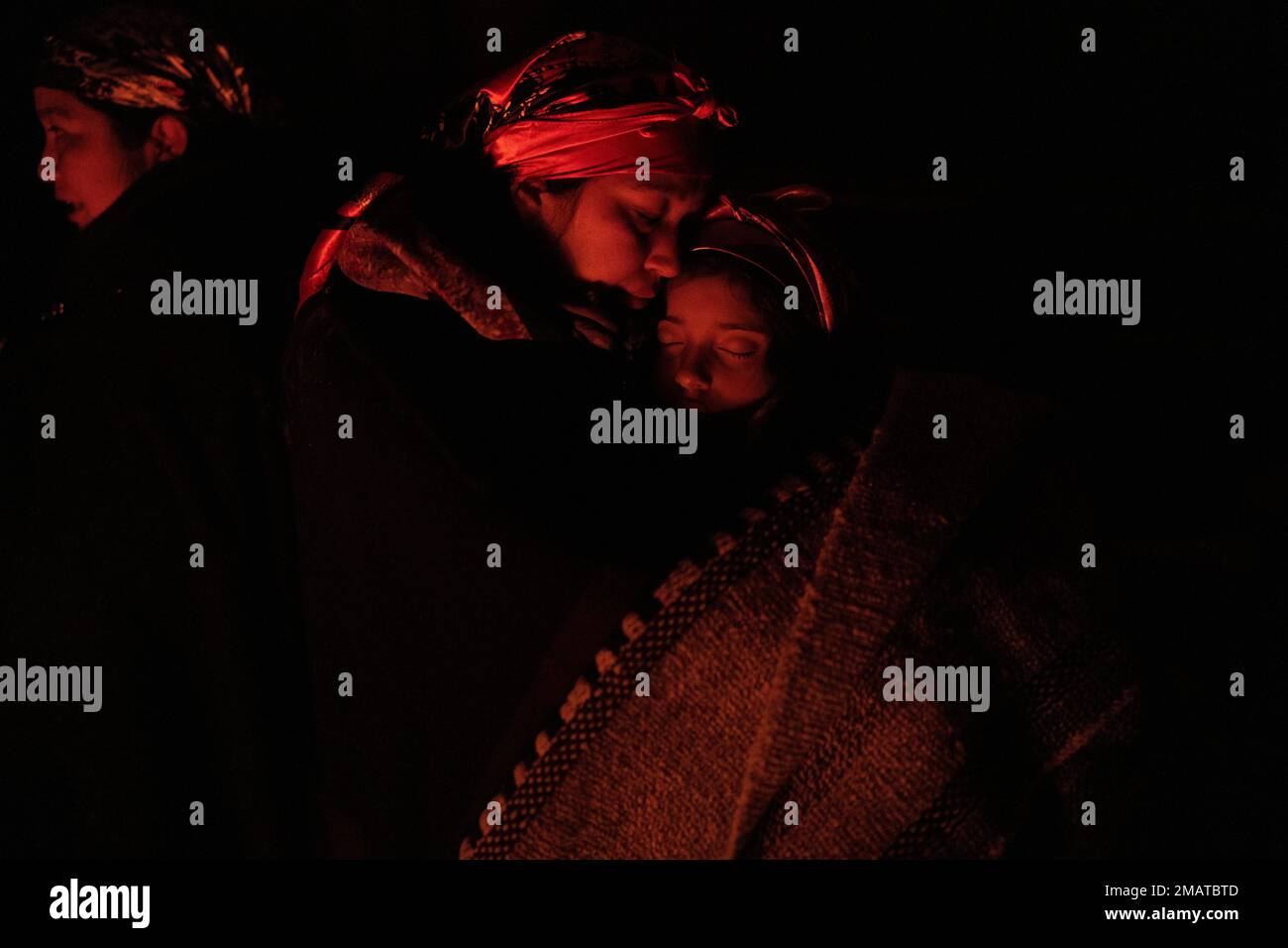 Nicole Yasmin Rojas embraces her 9-year-old daughter, Amy, during a ...