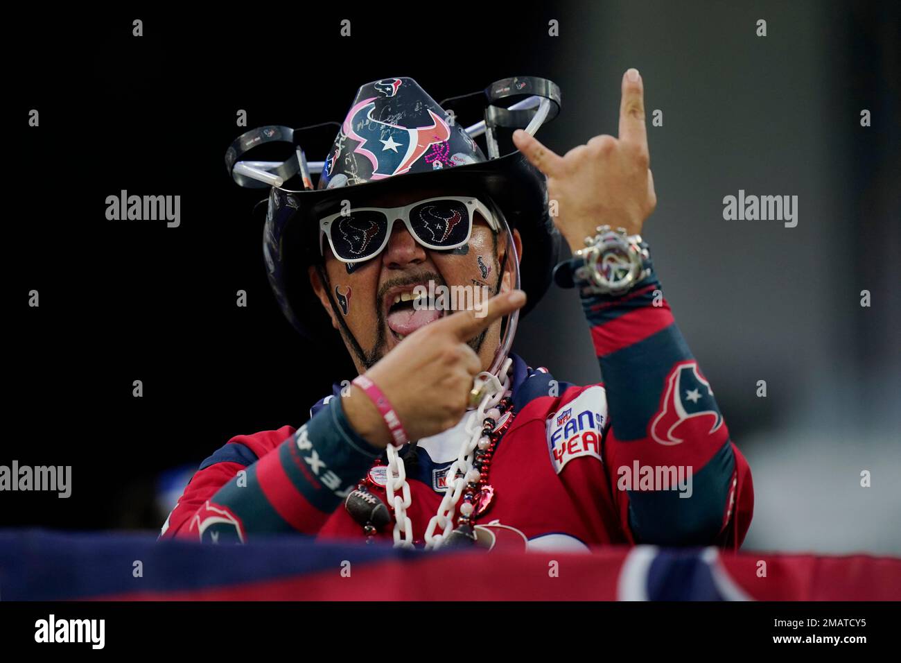 A Houston Texans fan cheers before a preseason NFL football game ...
