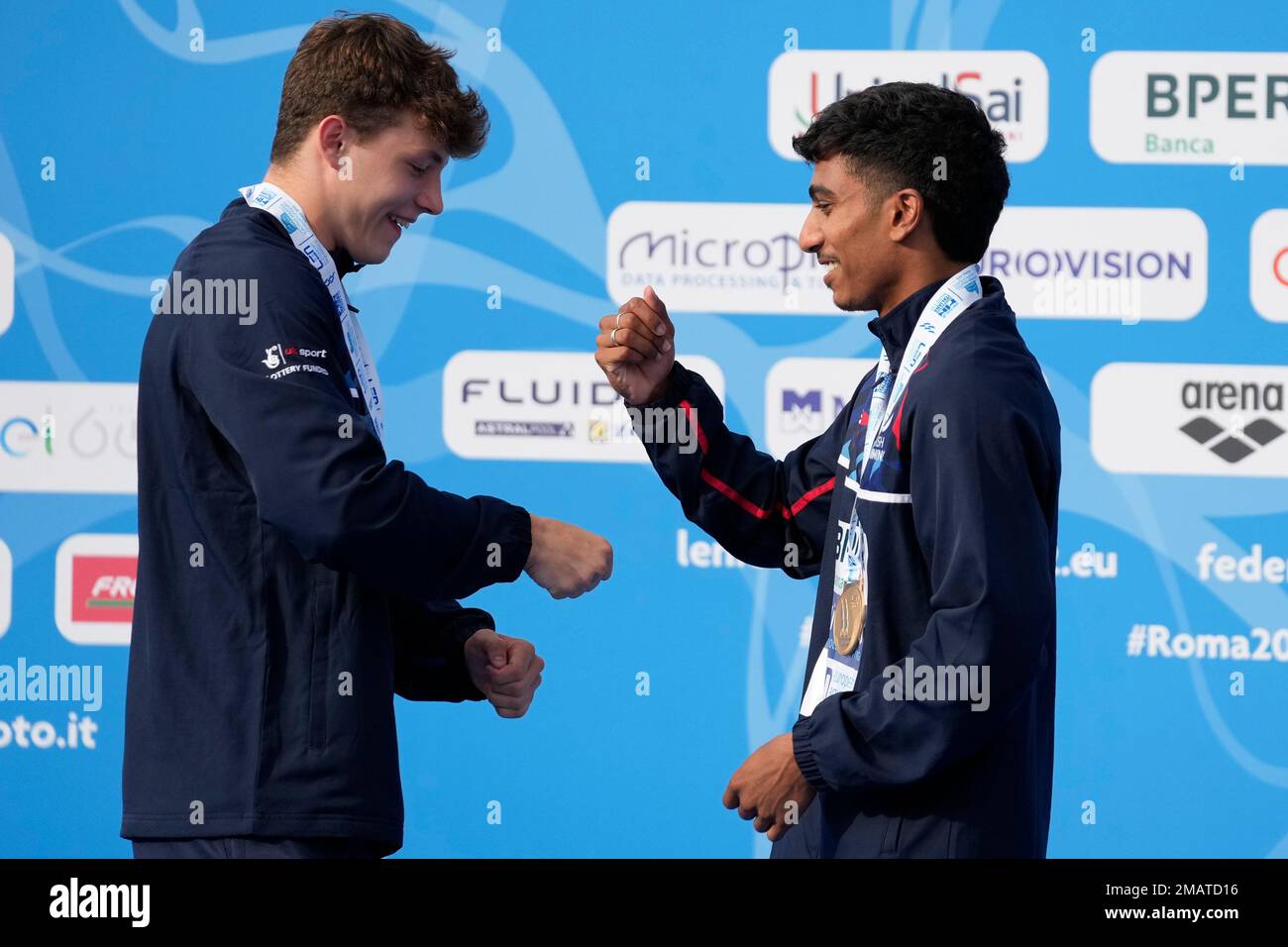 Ben Cutmore and Kyle Kothari of Britain celebrate the gold medal on the ...