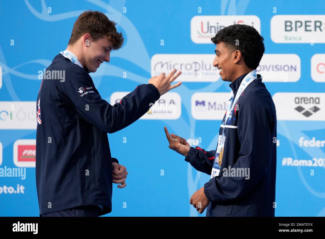 Ben Cutmore and Kyle Kothari of Britain celebrate the gold medal on the ...