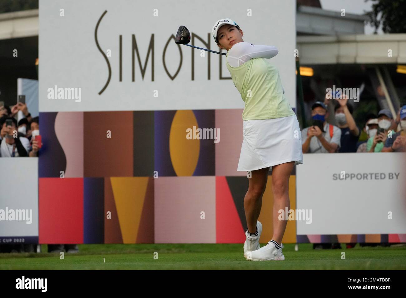 Japan's Hinako Shibuno hits off the first tee box during Simone Asia Pacific Cup golf tournament ...