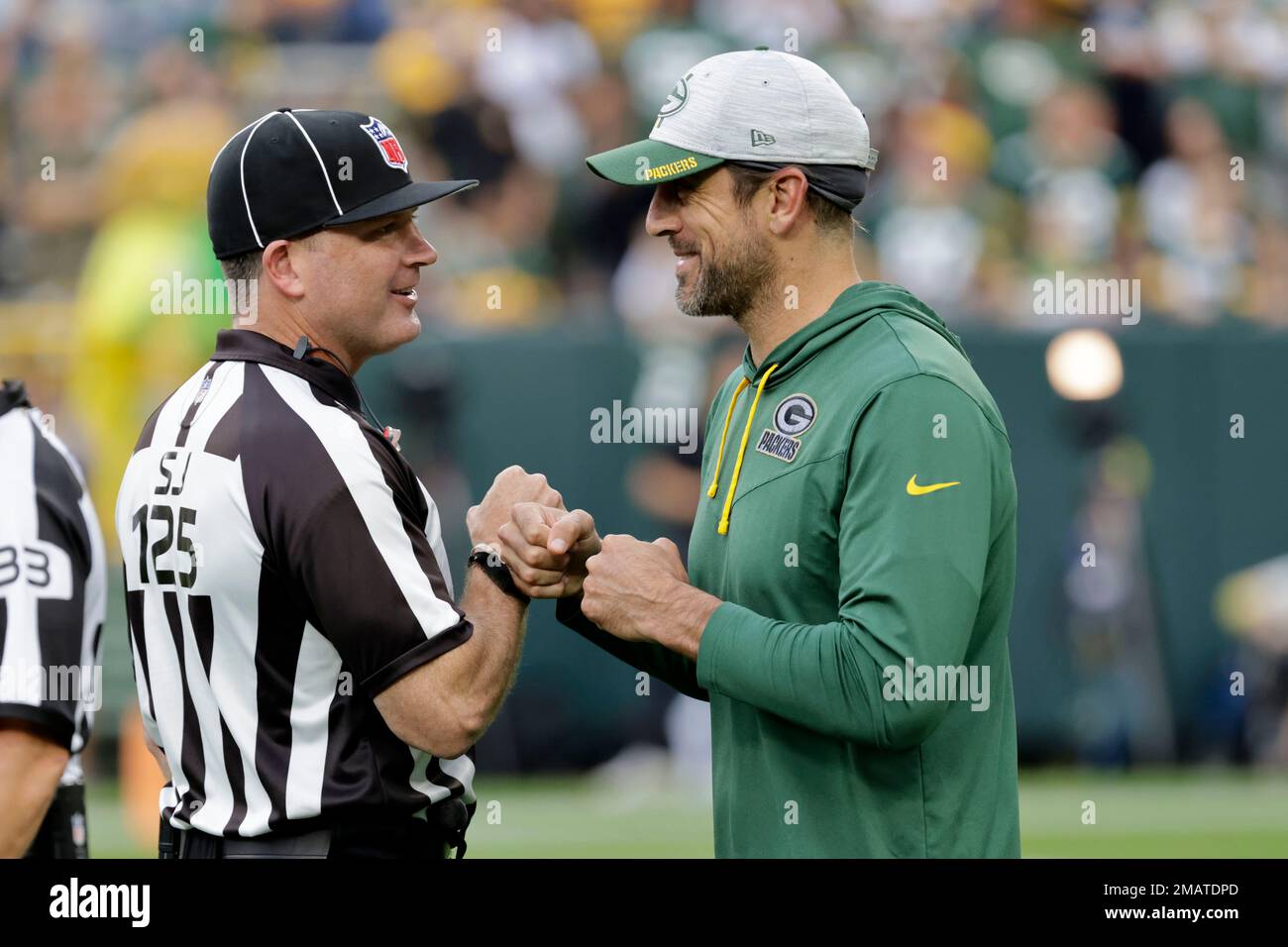 Green Bay Packers quarterback Aaron Rodgers greets side judge Chad Hill ...