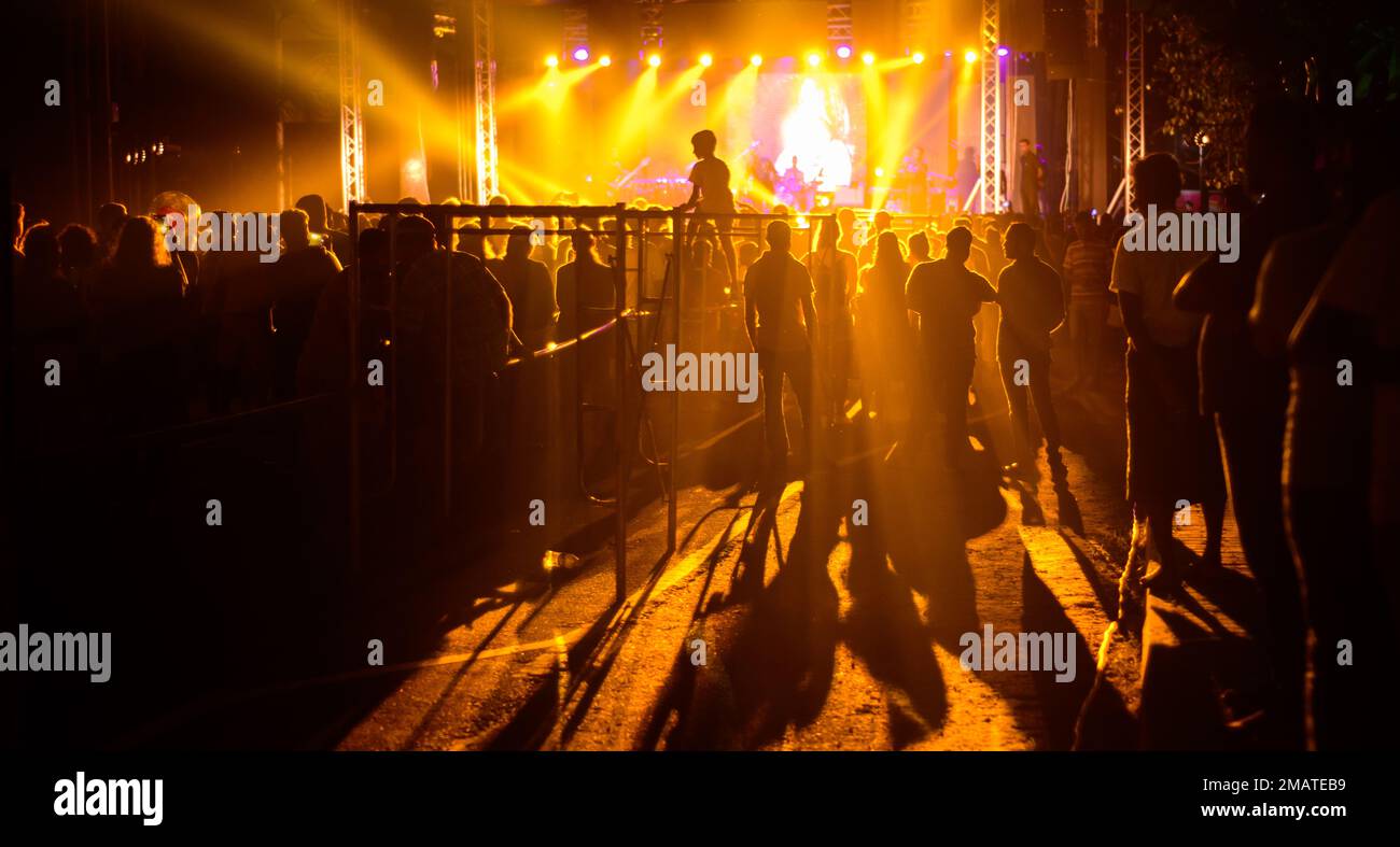 Silhouetted backlit Crowd at the night musical show Stock Photo - Alamy