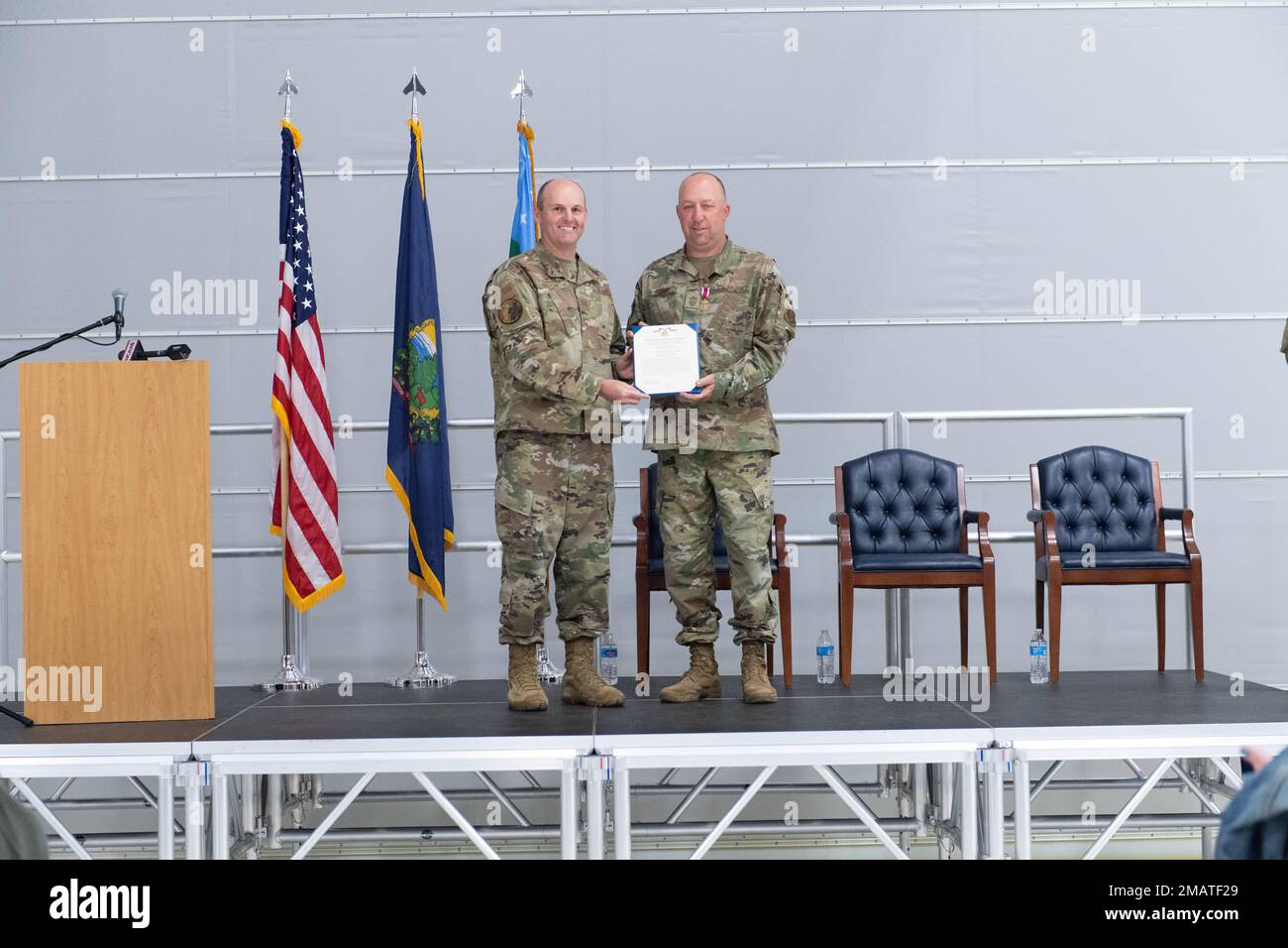Col. David Shevchik, commander of the 158th Fighter Wing, presents a ...