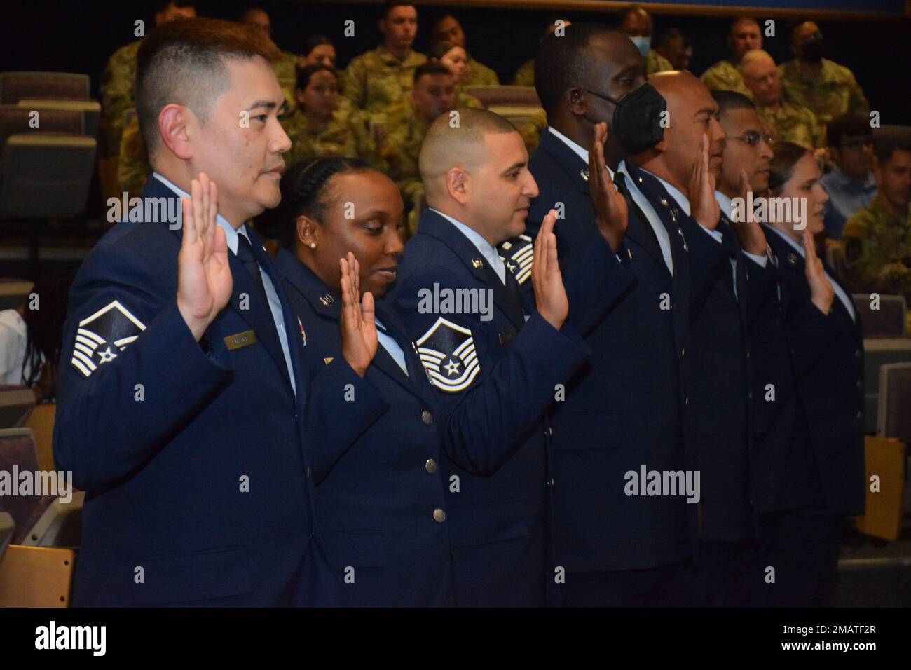 433rd Airlift Wing master sergeants raise their right hands to recite ...