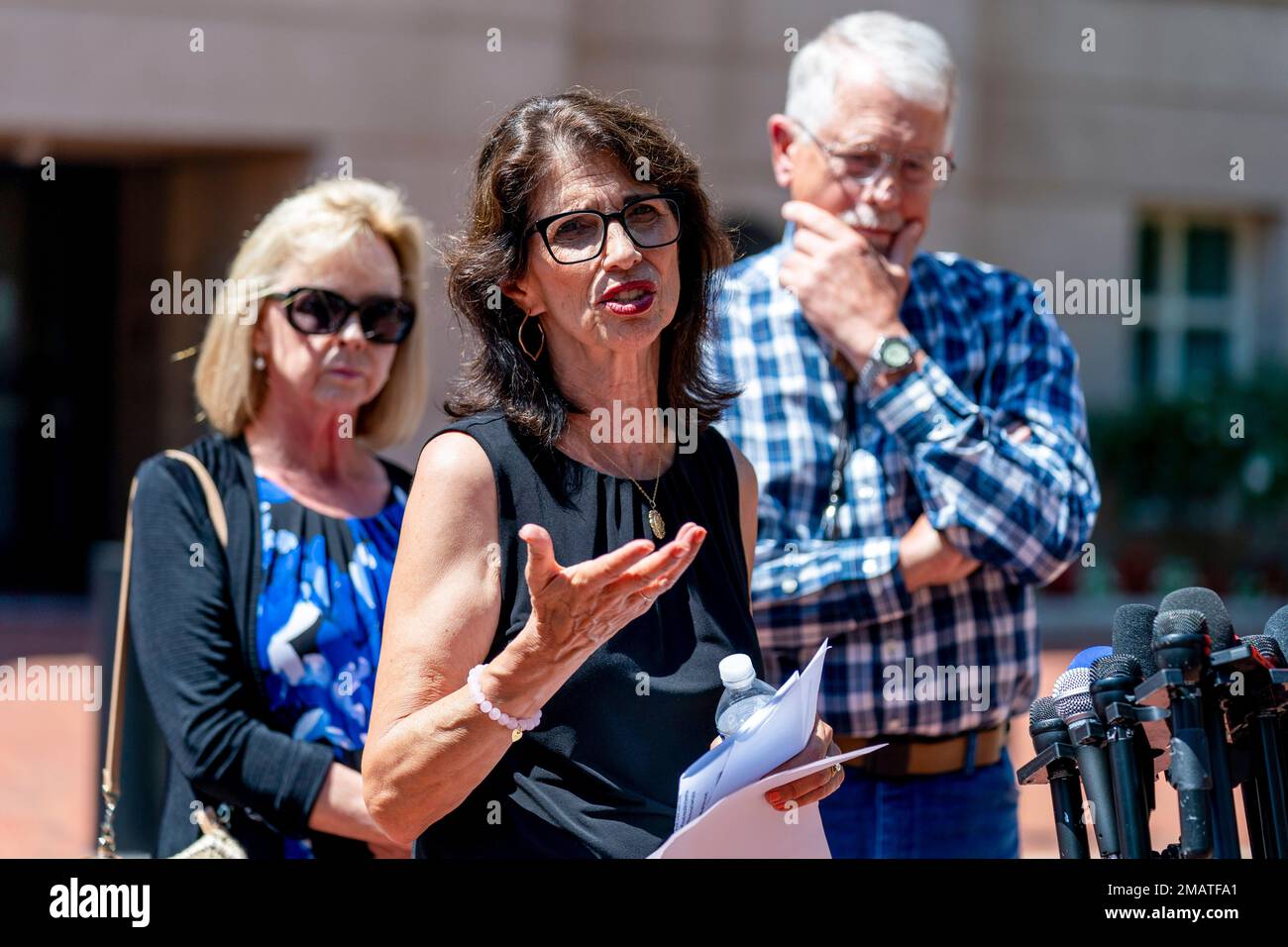 Diane Foley, the mother of James Foley, center, accompanied by Carl and ...