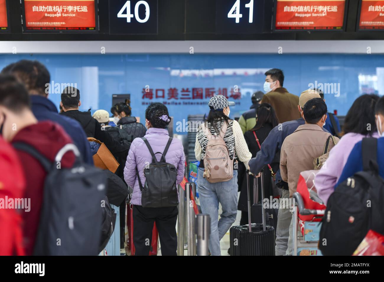 **CHINESE MAINLAND, HONG KONG, MACAU AND TAIWAN OUT** Passengers check ...