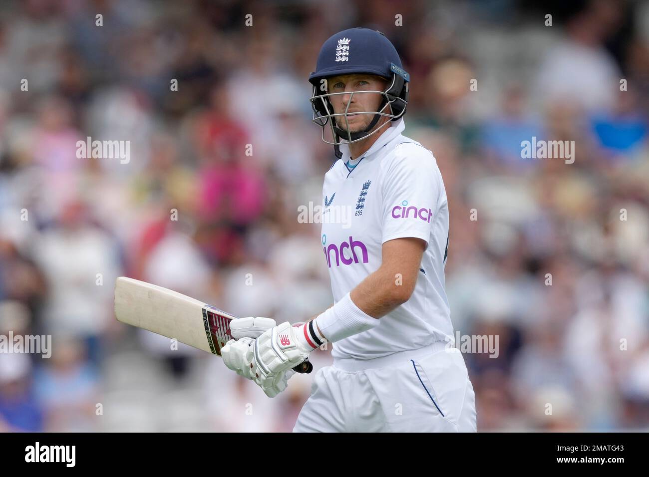 England's Joe Root leaves the pitch after he is caught off the bowling ...