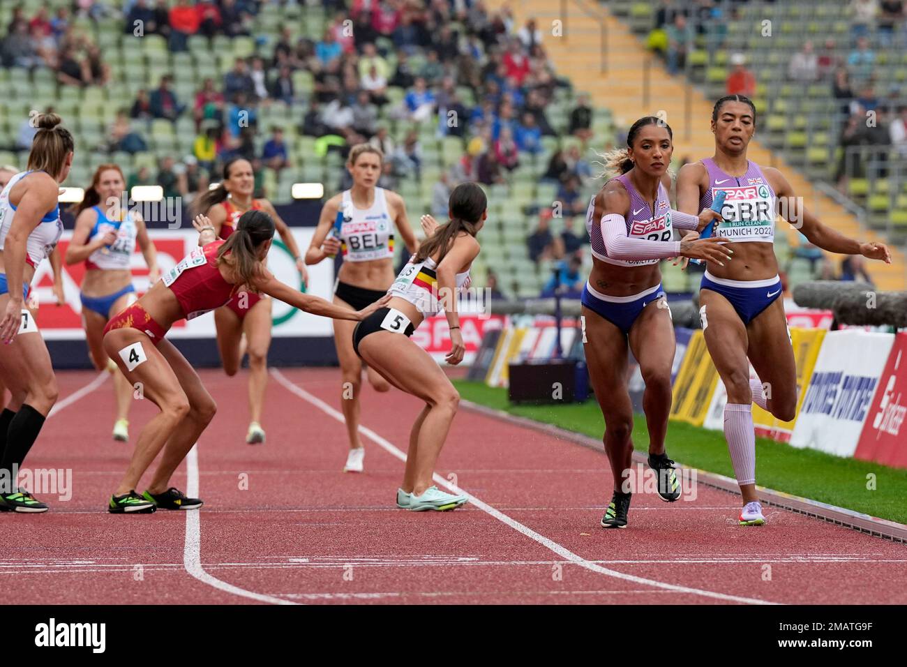 The team of Great Britain, right, lead in a Women's 4x400 meters relay ...