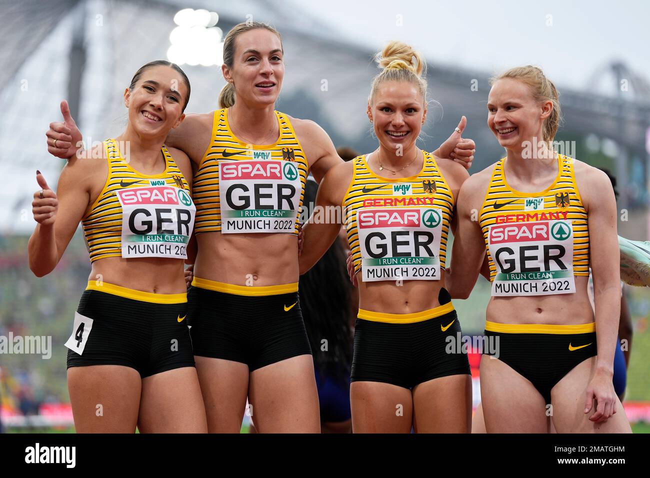 The team of Germany pose after qualifying in their Women's 4x100 meters ...