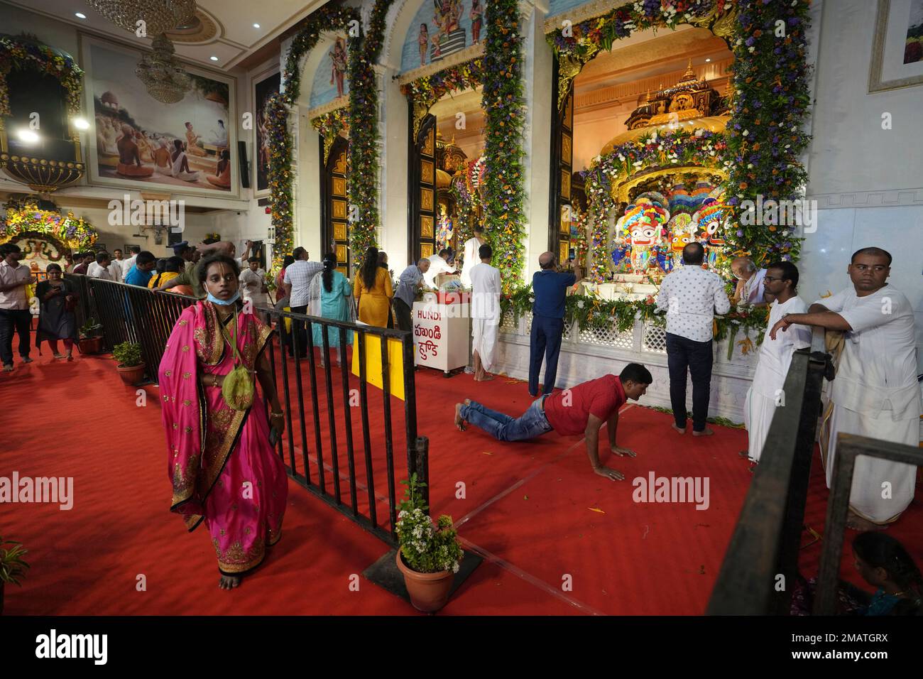 Hindu devotees offer prayers during Janmashtami festival at the ISKON ...