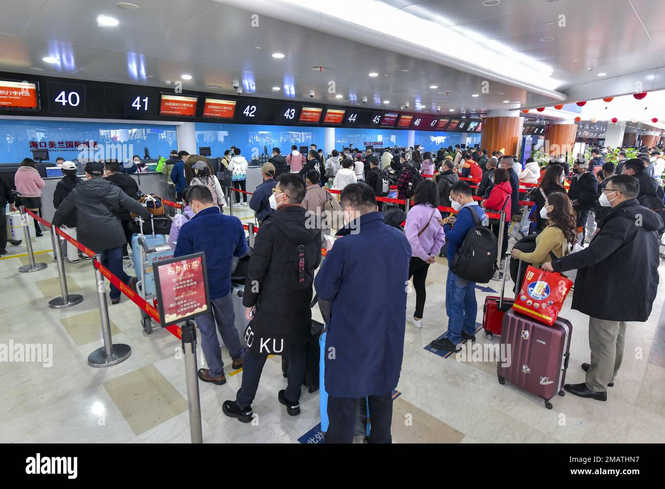 **CHINESE MAINLAND, HONG KONG, MACAU AND TAIWAN OUT** Passengers check ...