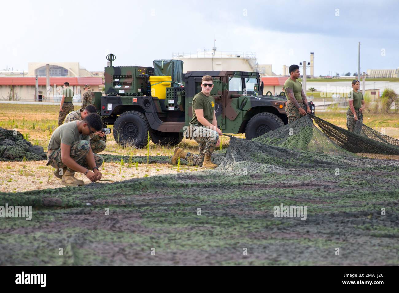 U.S. Marines with Marine Air Control Group (MACG) 18 set up camouflage ...