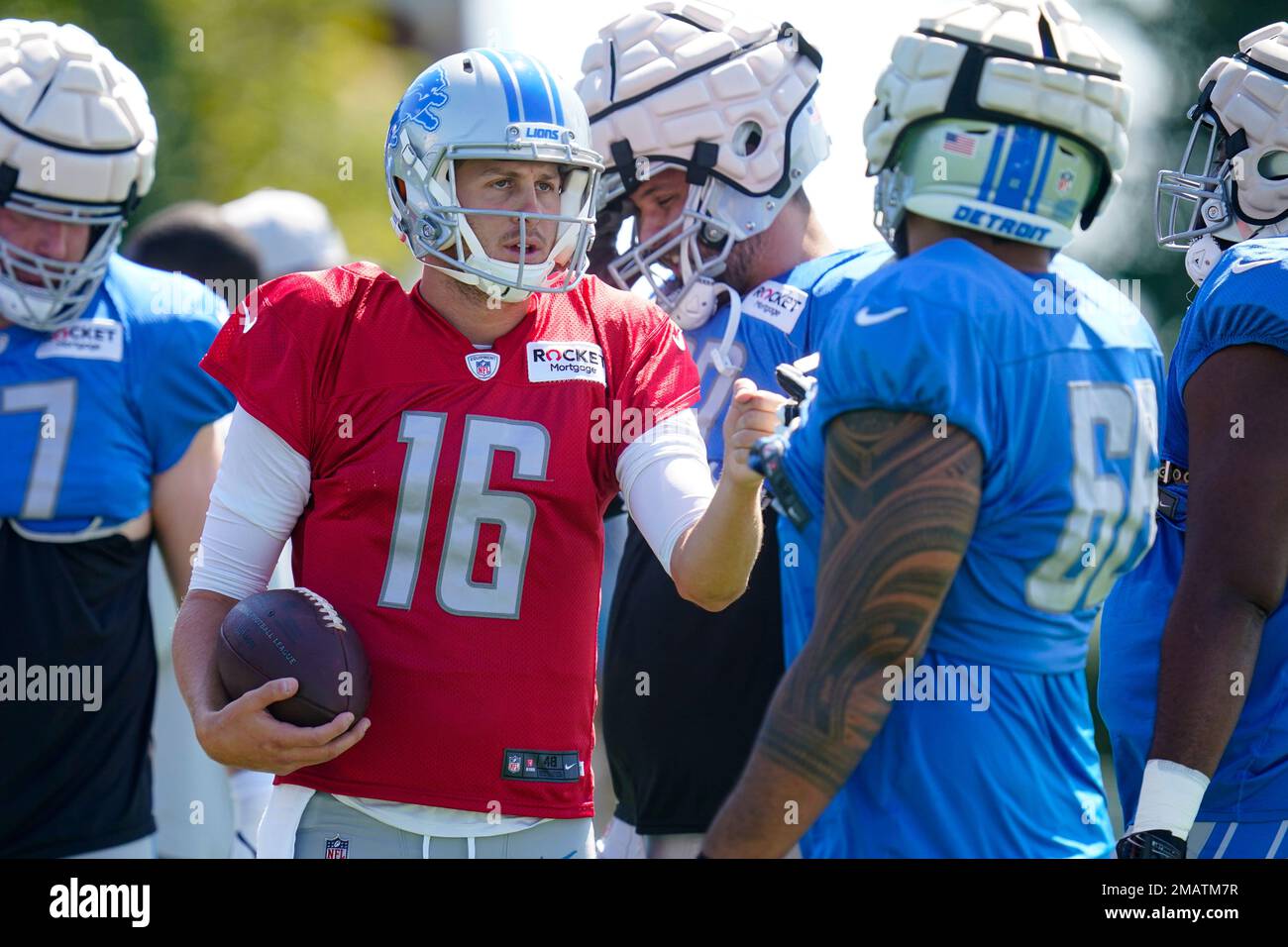 Detroit Lions quarterback Jared Goff (16) greets offensive tackle ...