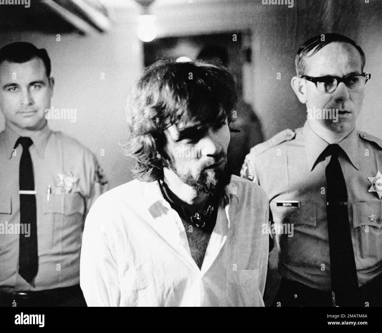 Accused killer Charles Manson is escorted to court by two deputies on ...