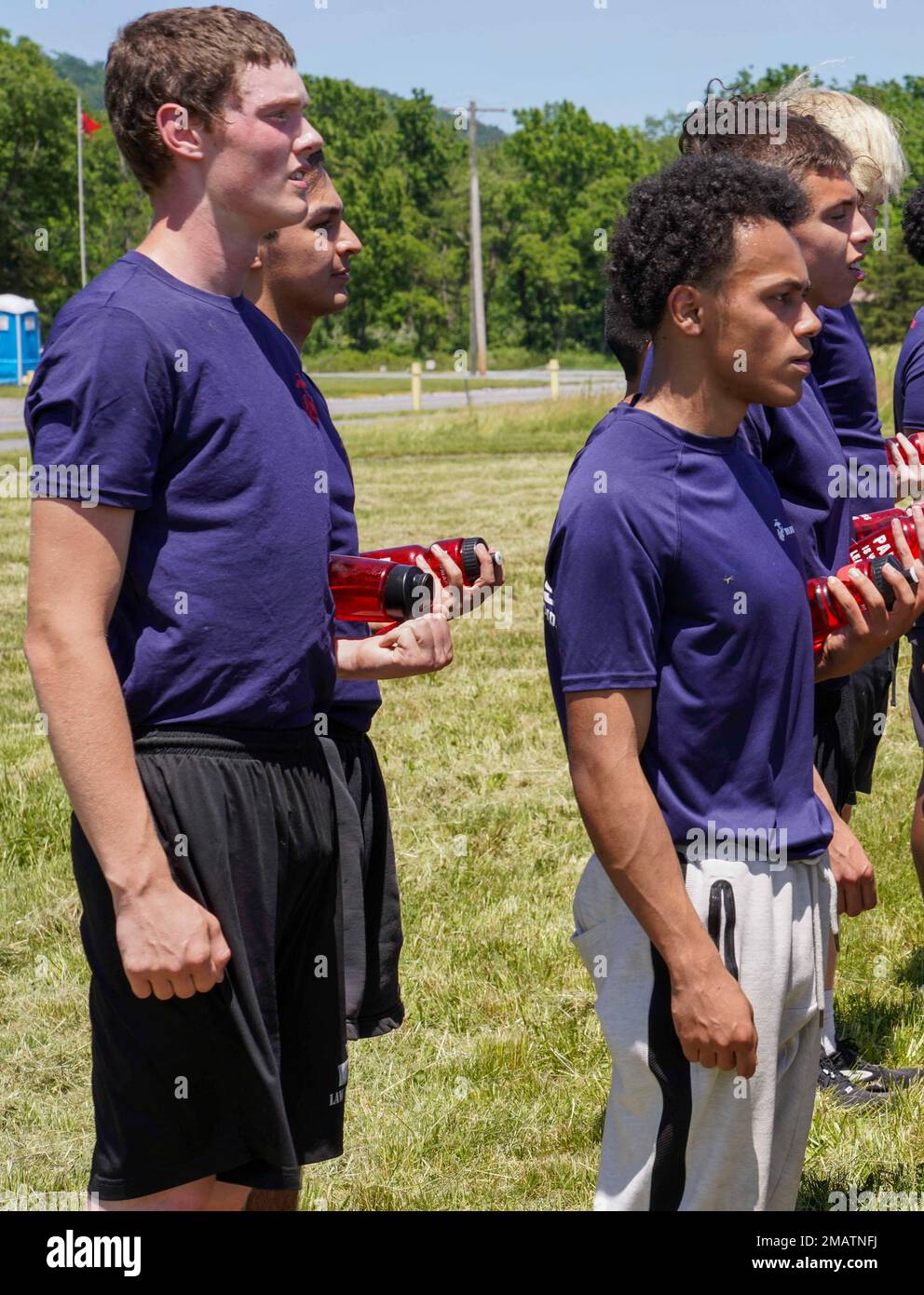 U.S. Marine Corps poolees participate in a mass formation during ...