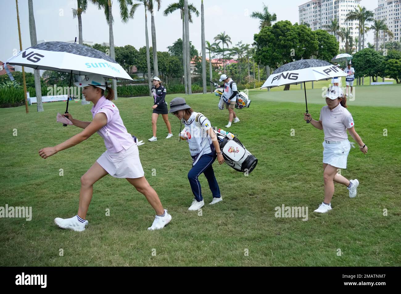 Japan's Hinako Shibuno, left, walks with her sister Kiriko after playing on the first day of ...