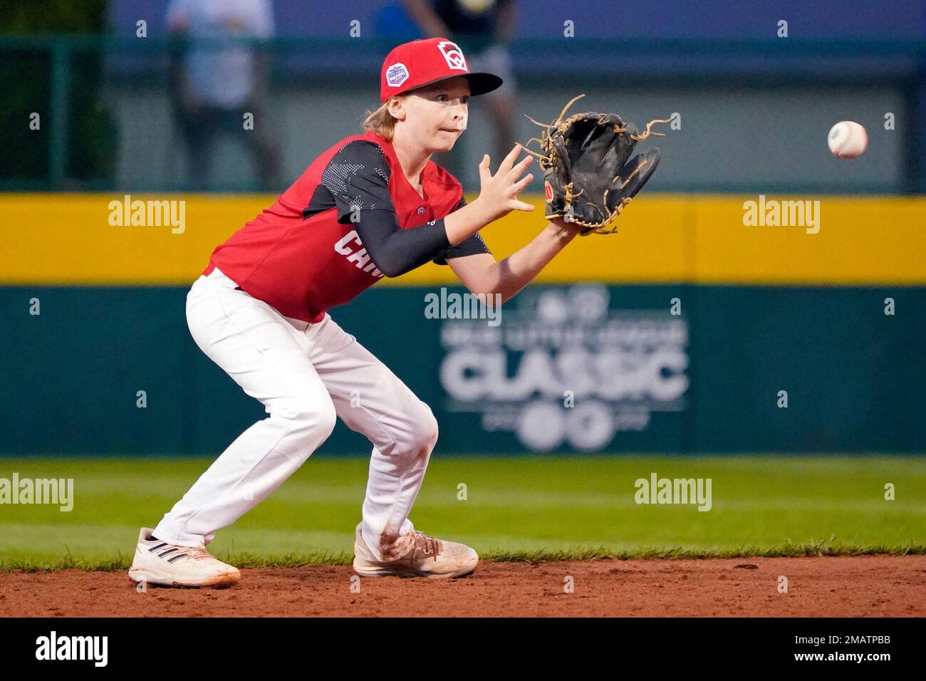 Canada's shortstop Ellis St. James (2) fields a ball hit by Australia's ...