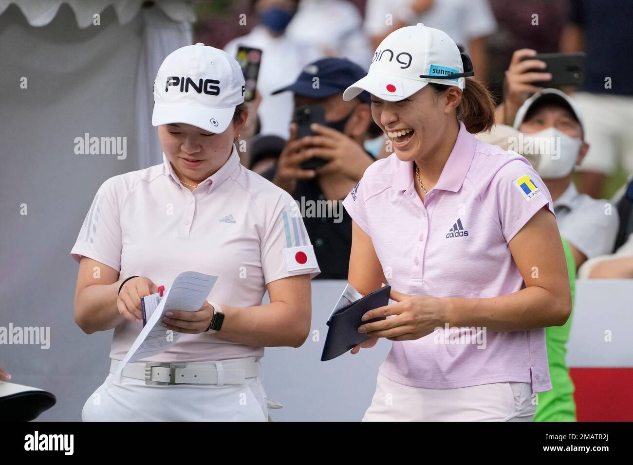 Japan's Hinako Shibuno, right, chats with her sister Kiriko as they prepare to play on the the ...