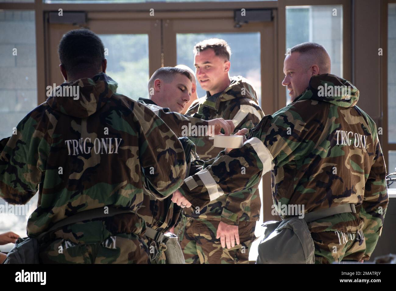 Members of the 221st Combat Communications Squadron practice putting on ...