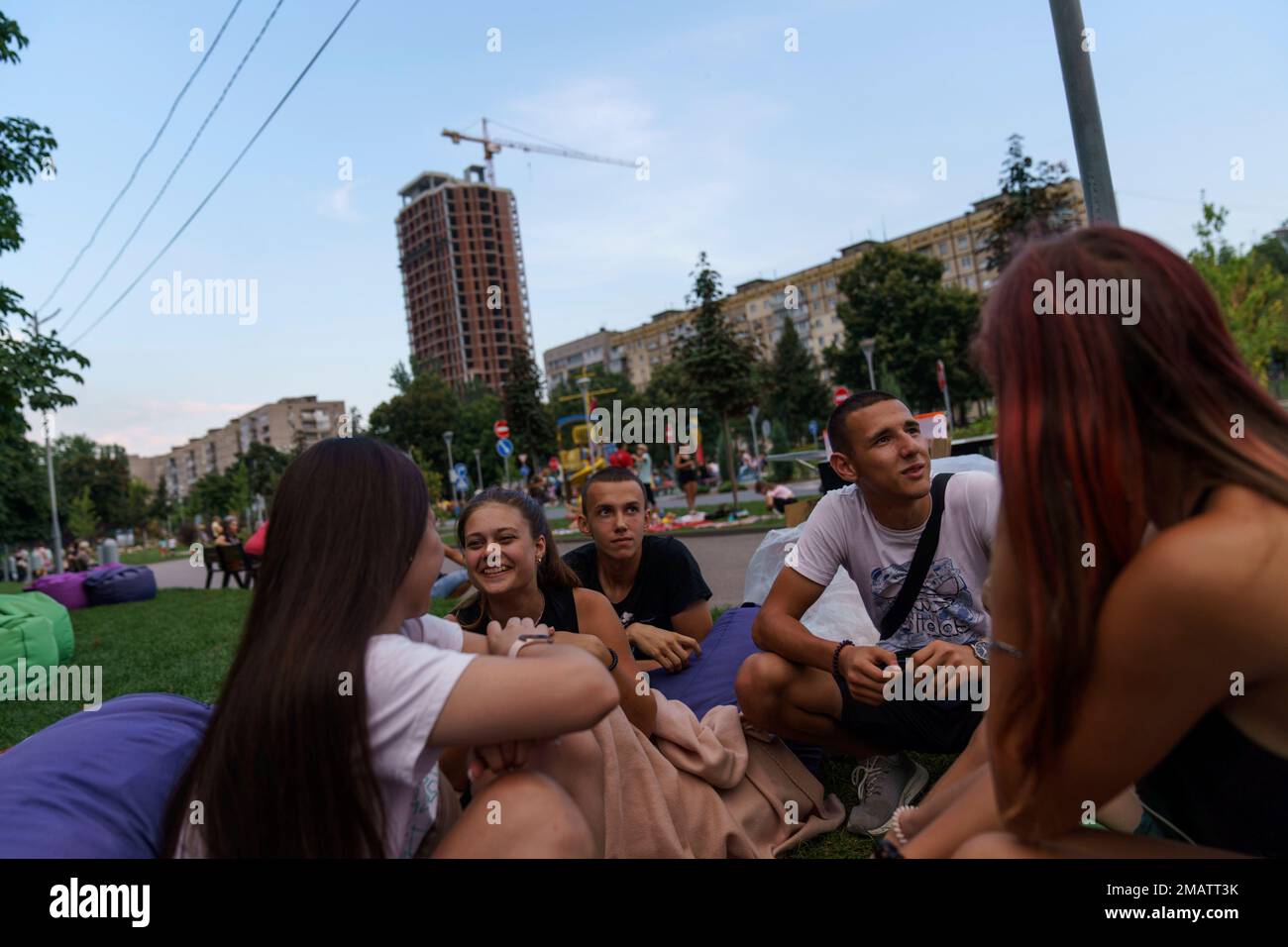 Teenagers gather at a park and sit on bean bags in Dnipro, Ukraine ...