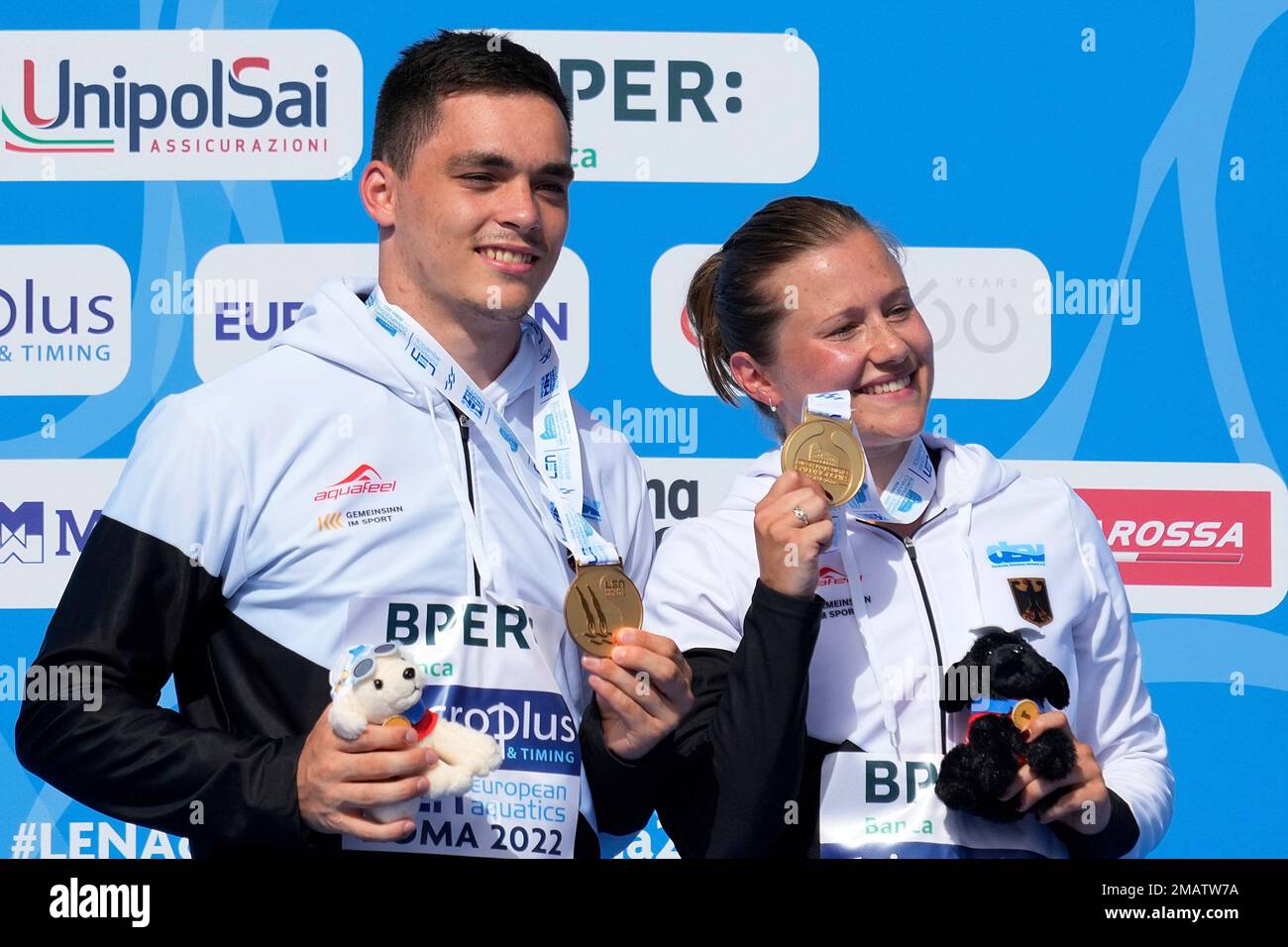 Lou Massenberg and Tina Punzel of Germany celebrate holding the gold ...