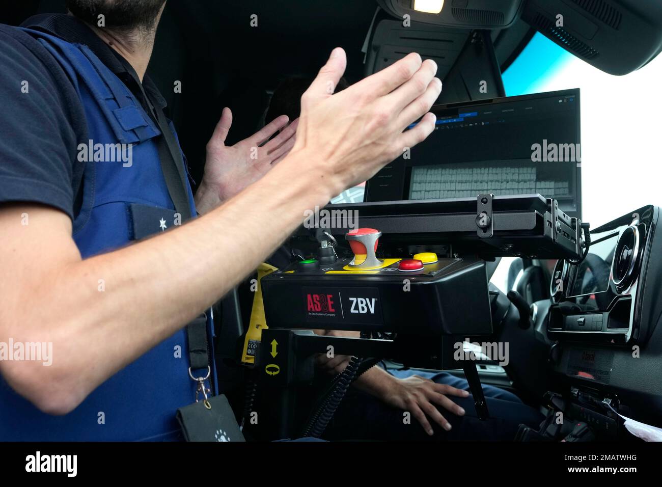 A customs officer describes an image of the inside of a container shown ...